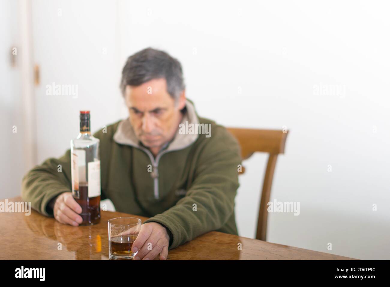 Adult person affected by alcohol addiction Stock Photo - Alamy