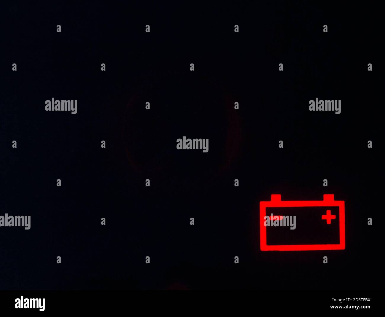 Red battery icon on a black background. Car battery discharge concept ...