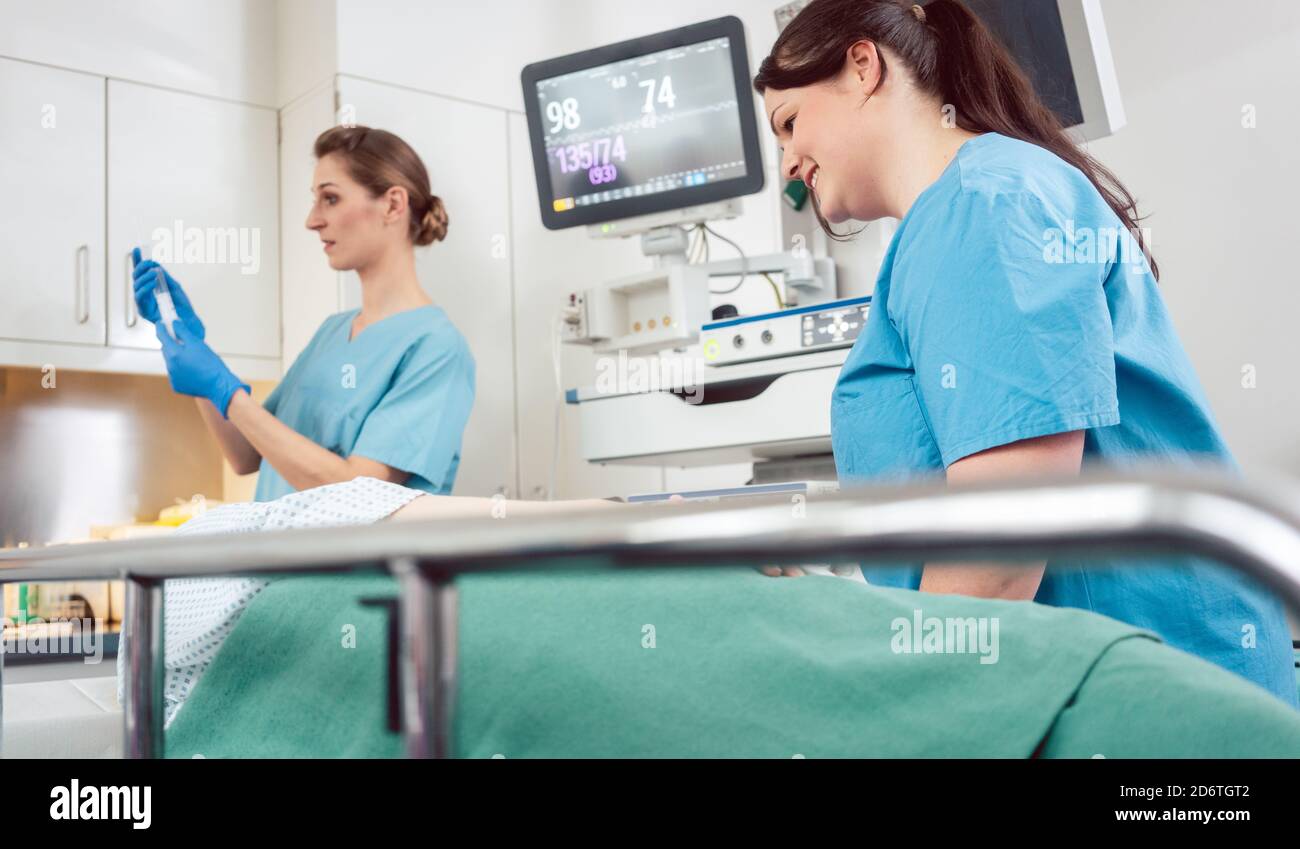 Nurses working in preparation of surgery Stock Photo - Alamy