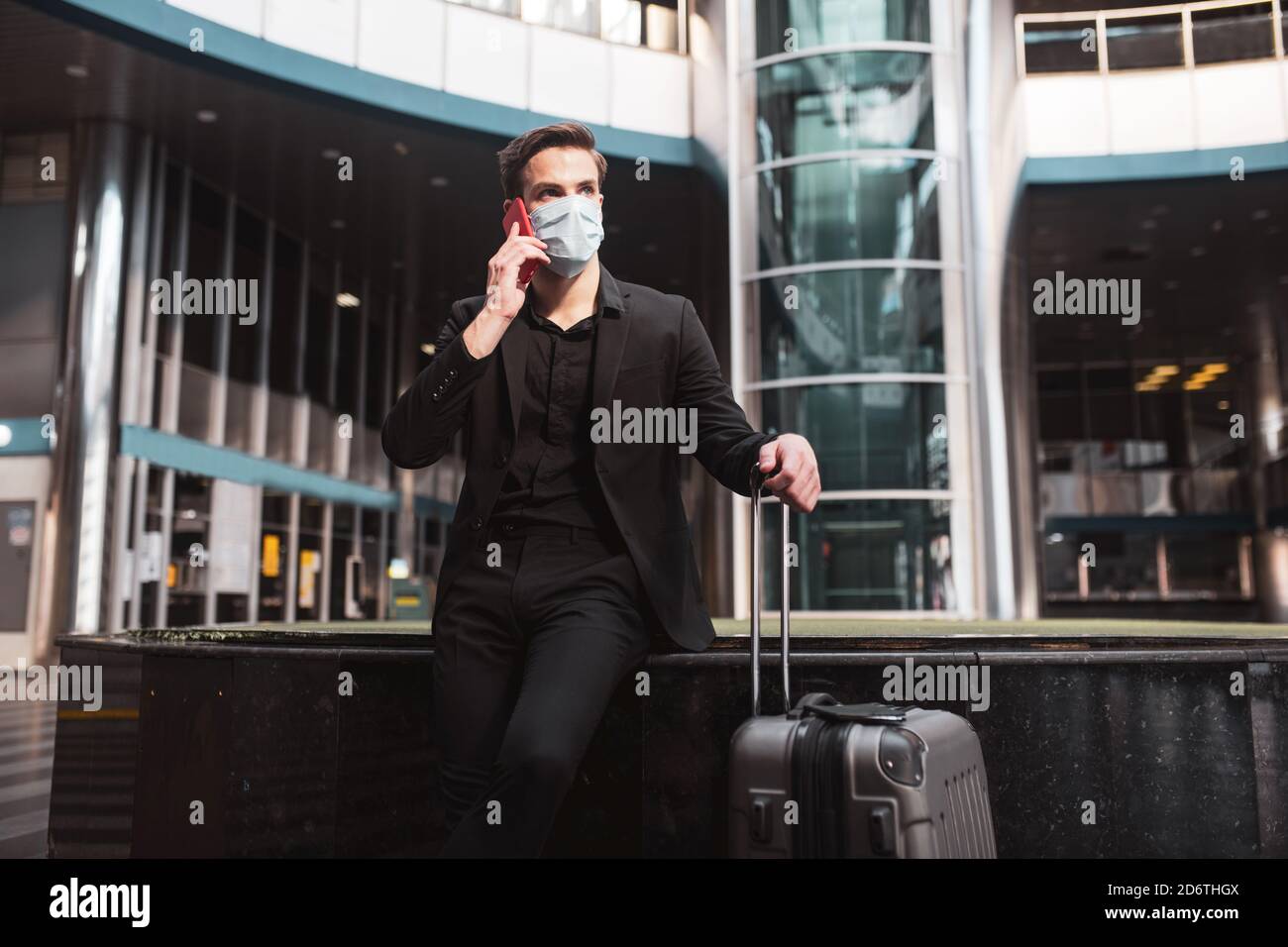 Man talking on phone on plane hi-res stock photography and images - Alamy