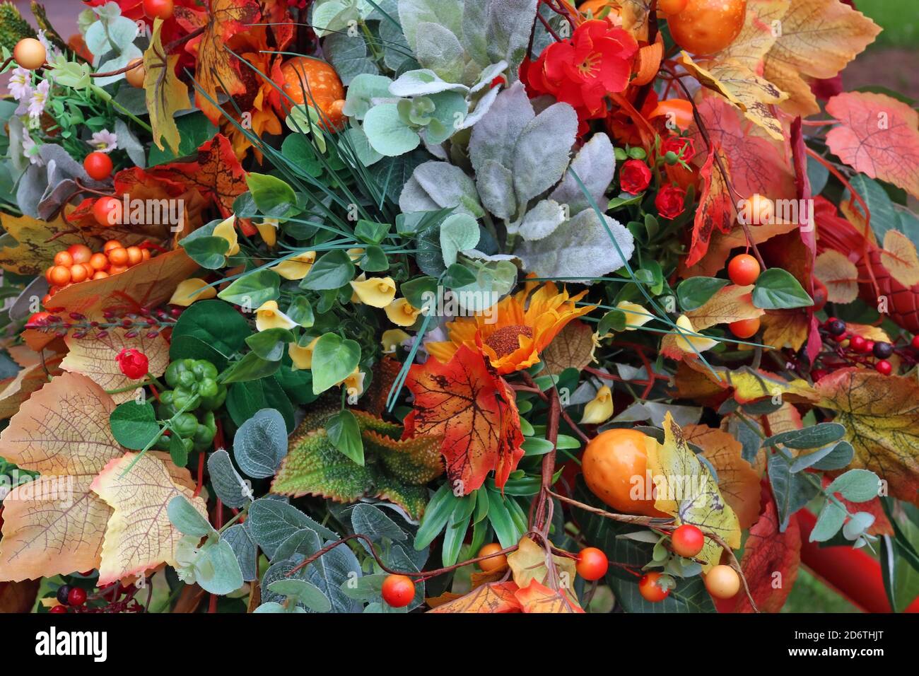 Plastic flowers and fall leaves hi-res stock photography and images - Alamy