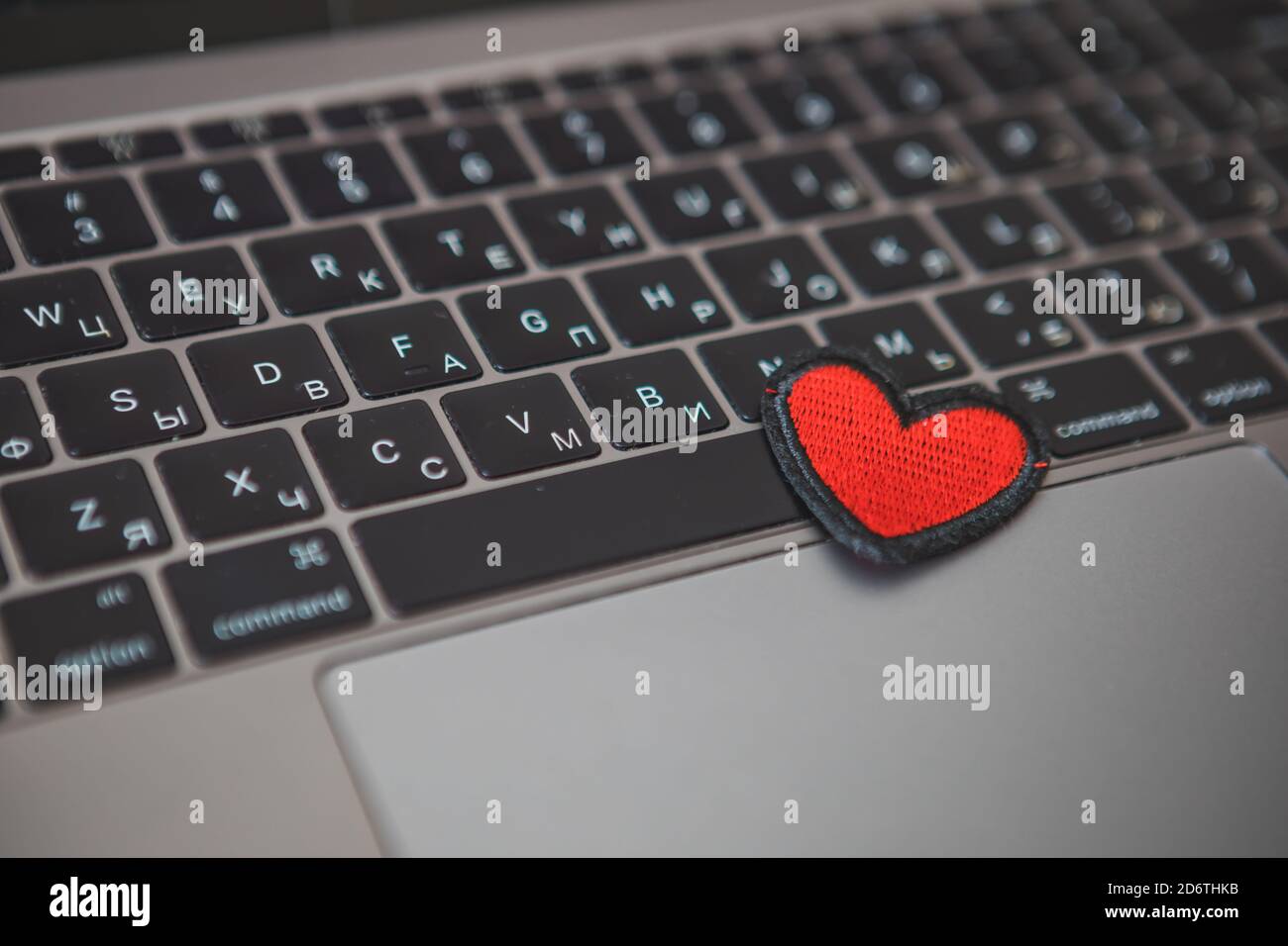 red heart symbol on laptop keyboard. online dating Stock Photo - Alamy