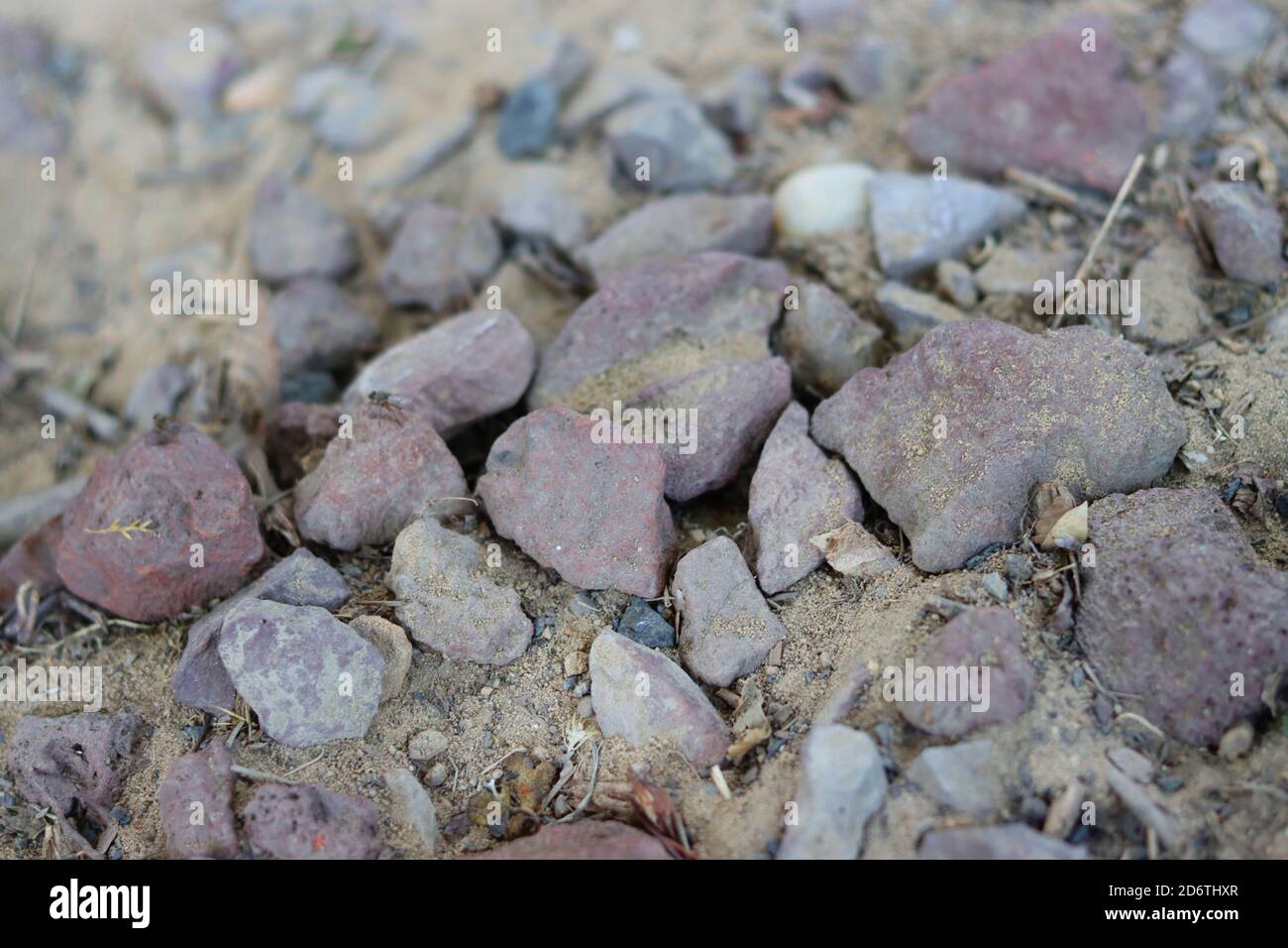 A pile of rocks in dirt Stock Photo - Alamy