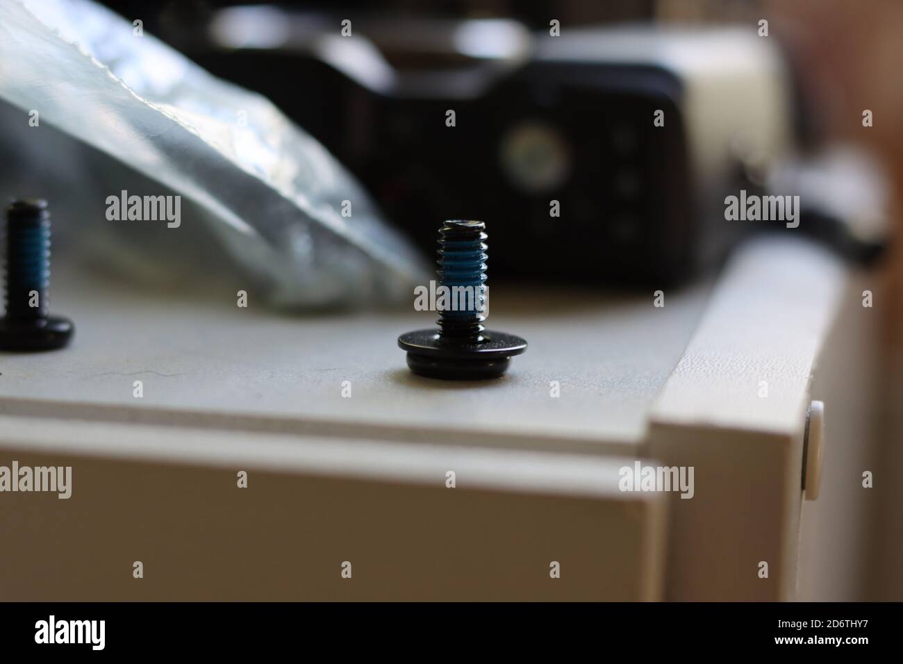 A screw on top of a cabinet Stock Photo - Alamy