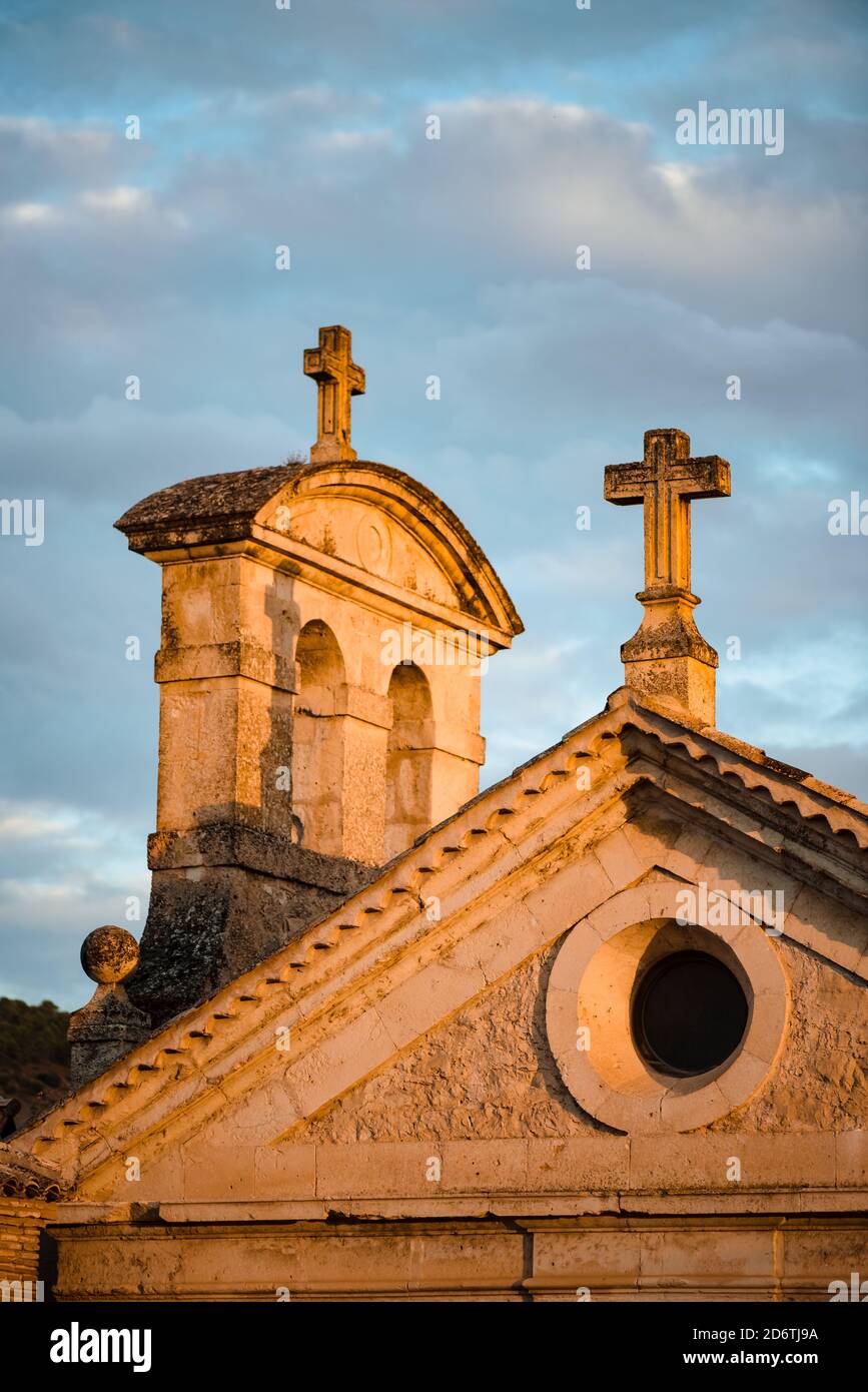 Low angle detail of medieval stone church building with crosses on top ...