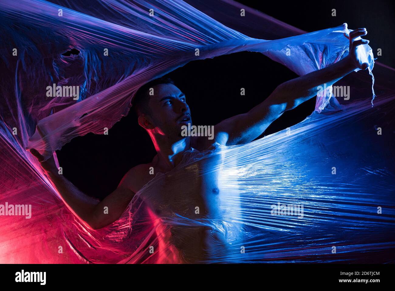 Aggressive male in casual clothing shouting and looking at camera while ...