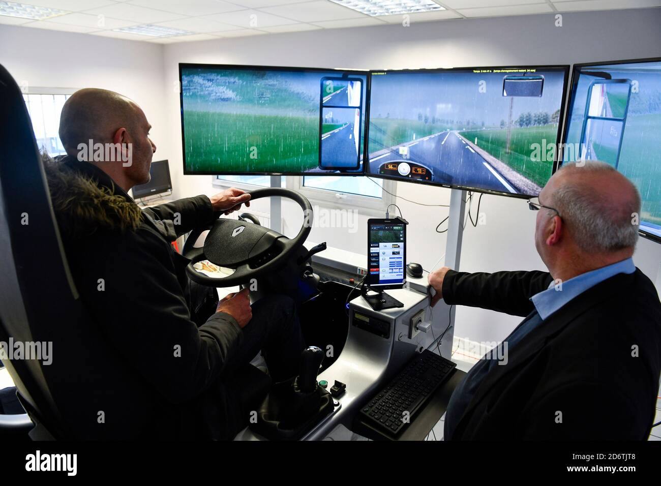 Road safety: man driving in the rain, truck driving simulator at AFTRAL ...