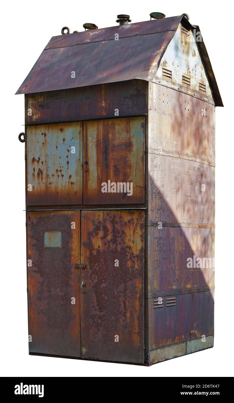 A tall firewood storage shed made of rusty transformer boxes. Isolate ...