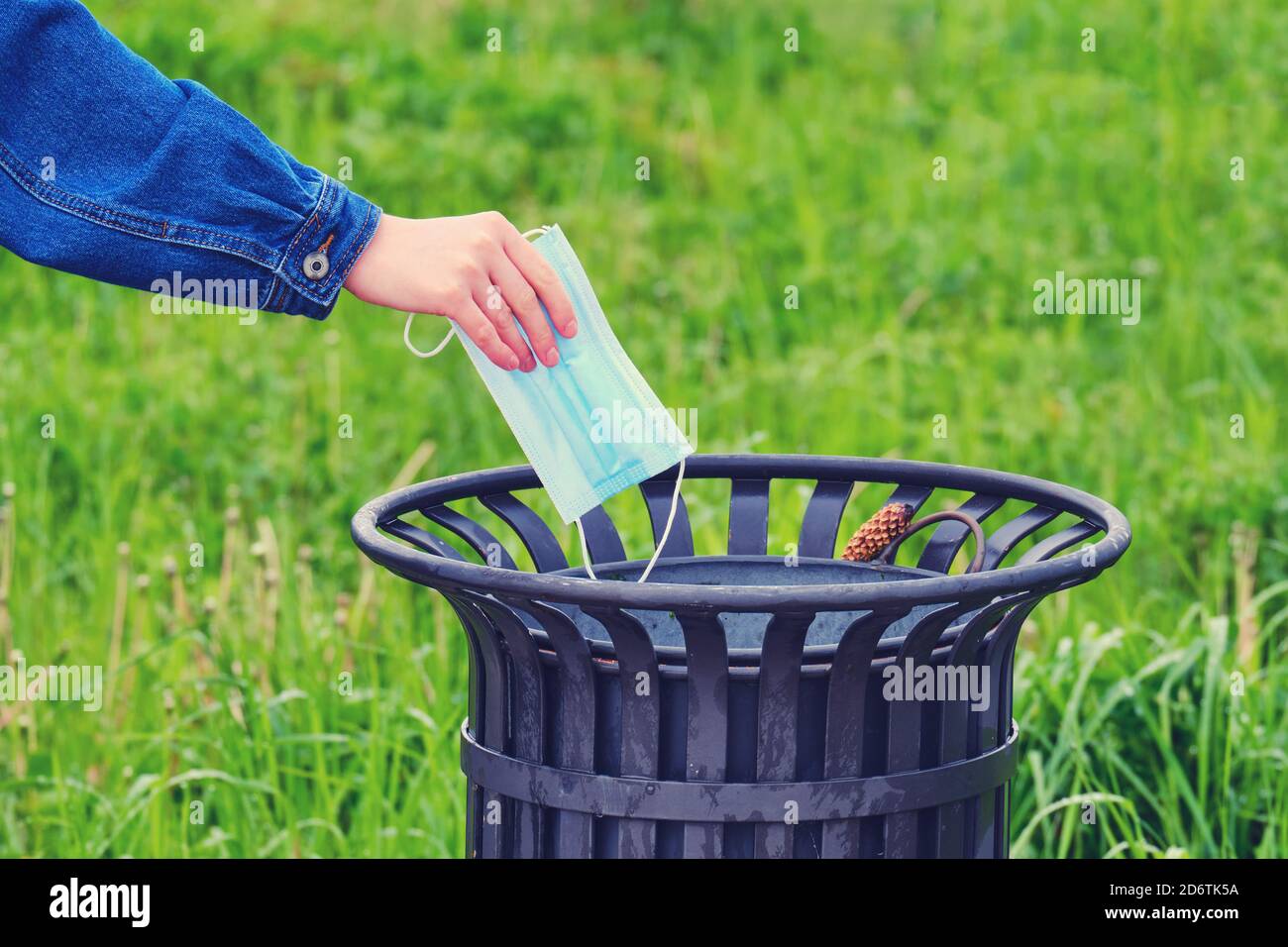 Female hand throws trash hi-res stock photography and images - Alamy