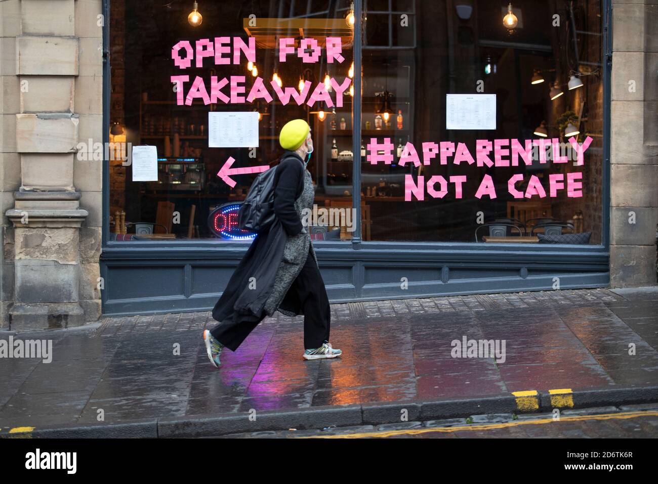 A woman walks past Scran cafe in Edinburgh's Cockburn Street after a ...