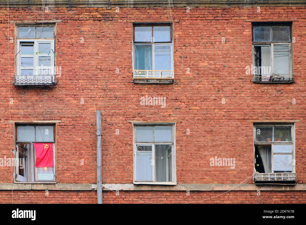 Red flag of the Soviet Union on an old brick building Stock Photo - Alamy