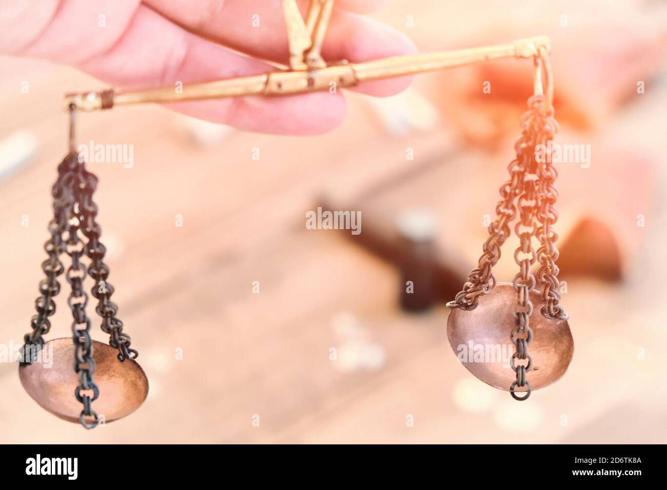 Retro scales on the chain close-up. Vintage bronze scales in hand Stock ...
