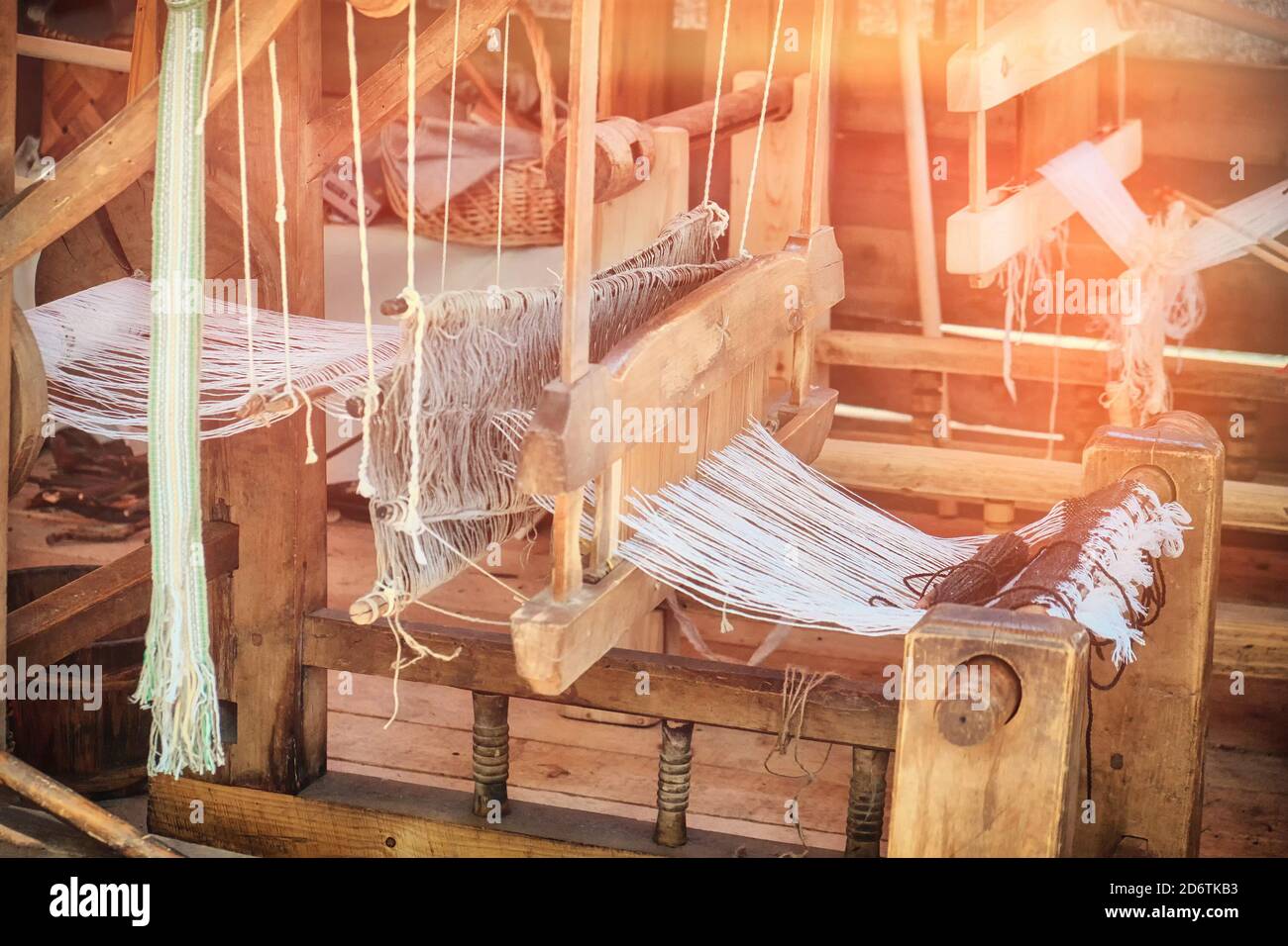 Retro loom for fabric making. Traditional vintage weaving machine for ...