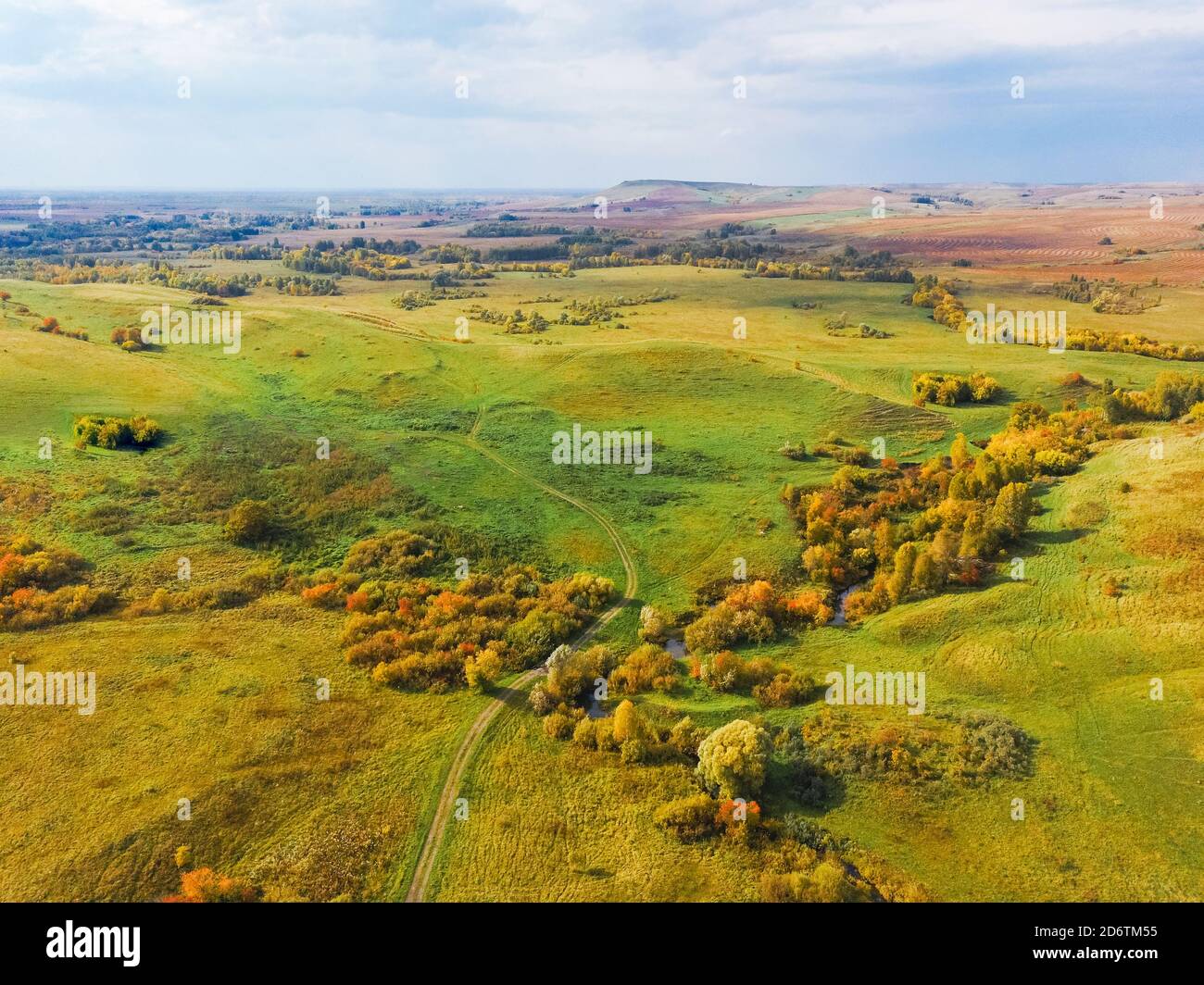 Aerial view of autumn landscape with hills and yellow trees Stock Photo ...