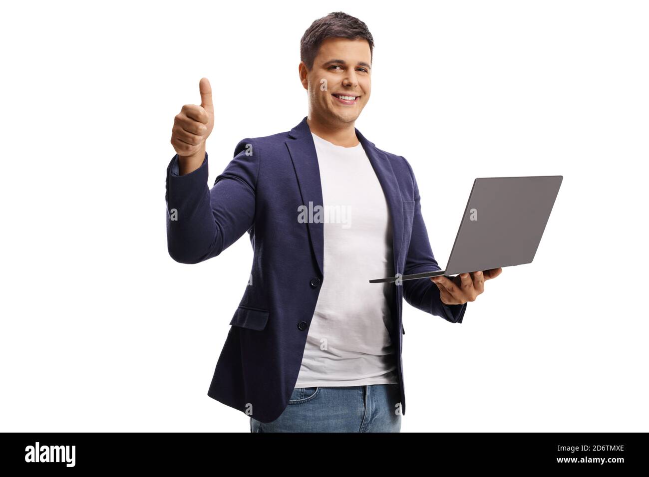 Cheerful young man holding an open laptop computer and showing thumbs ...