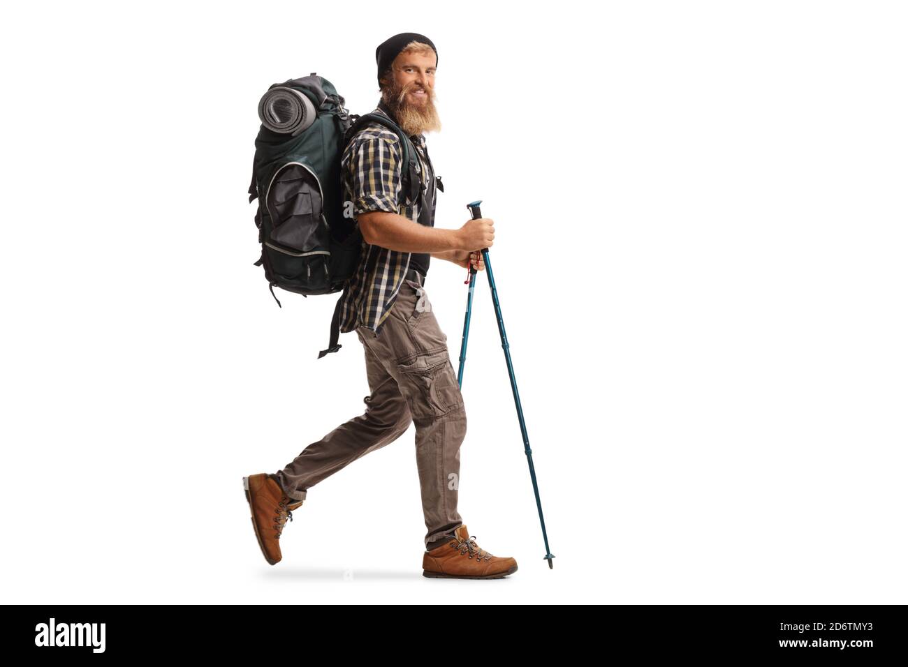 Full length profile shot of a bearded guy hiker with a backpack and ...