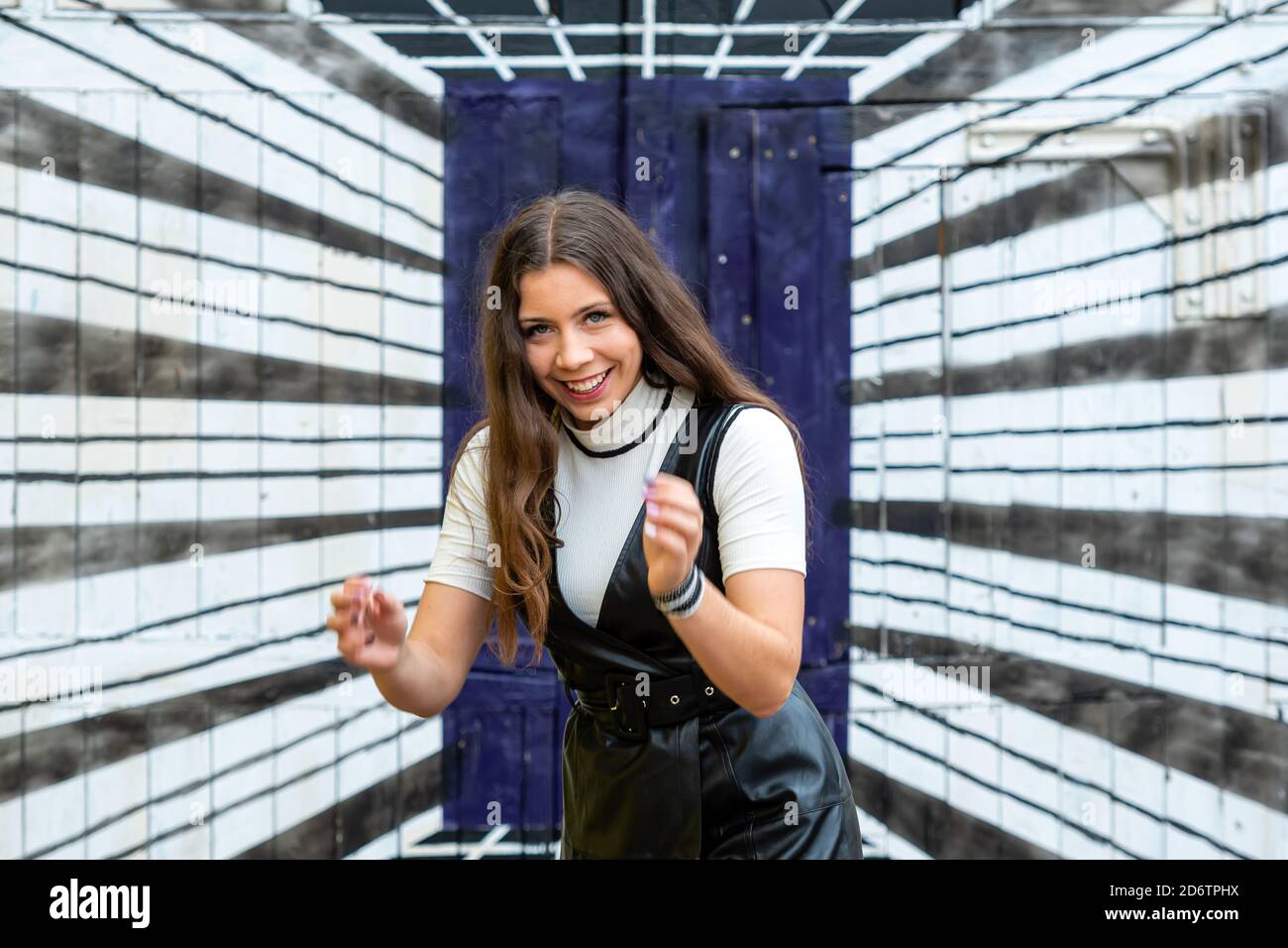 portrait of a young flirty funny woman on the background of a 3d three ...