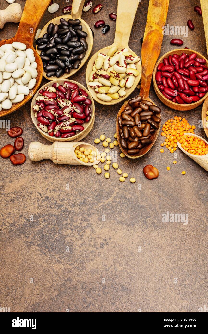 Set of various dry legumes in wooden spoons, indispensable protein for ...
