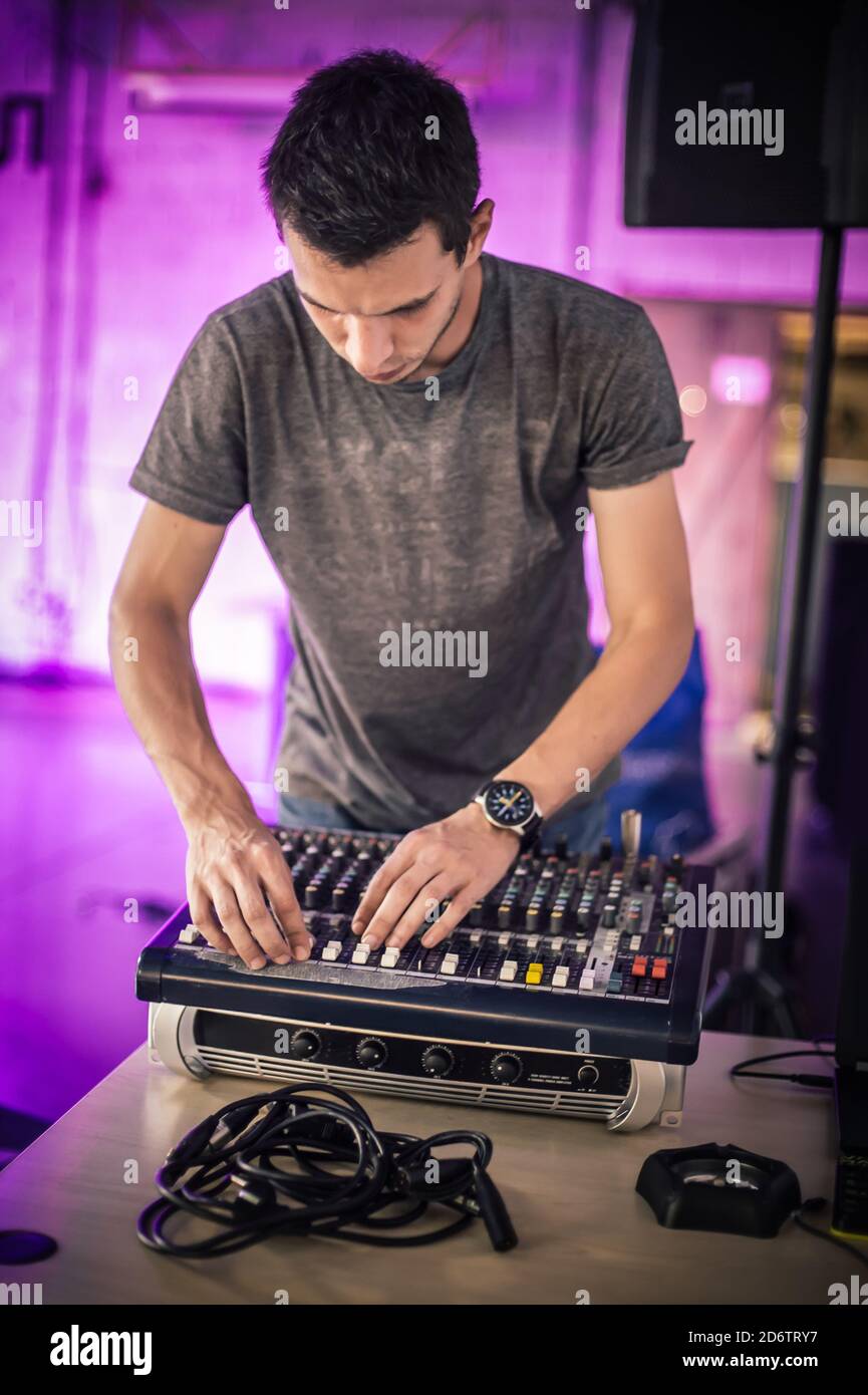 Behind the scene. Sound technician electric engineer adjusting sound ...