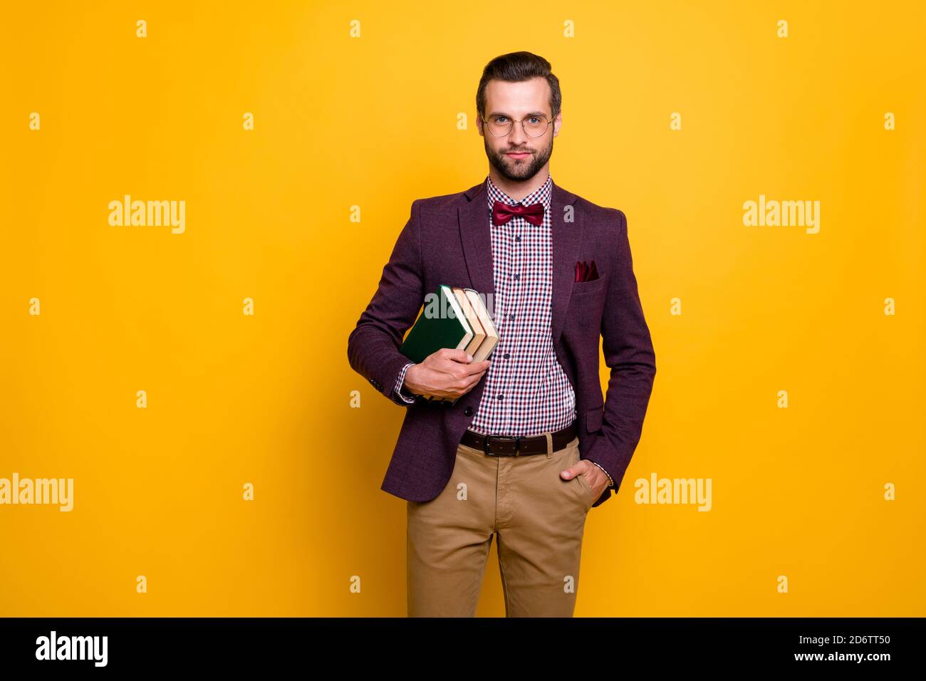 Photo of handsome cheerful rich clothes guy student hold many books ...