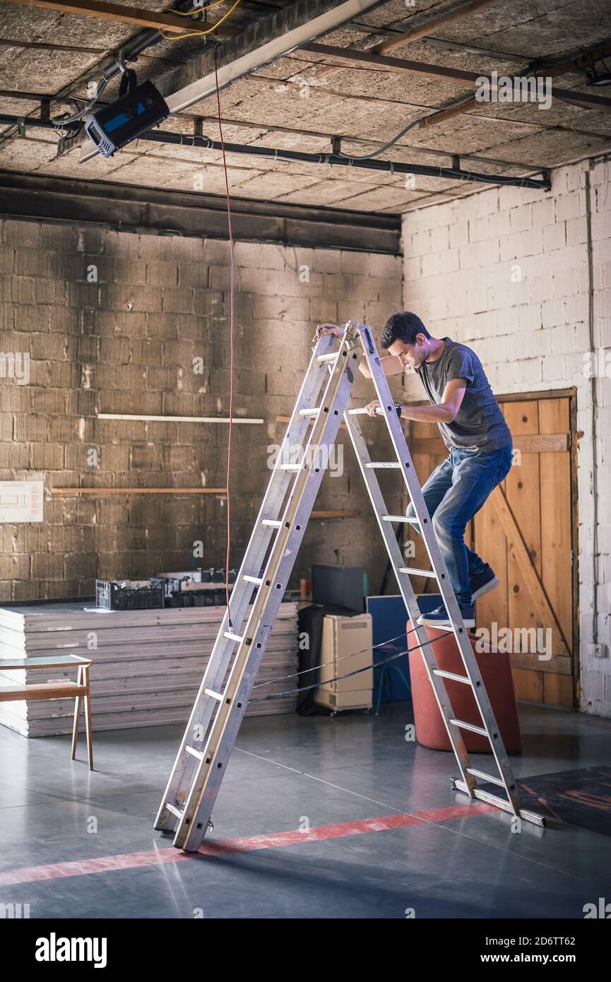Behind the scene. Sound engineer is connecting the audio cables in the ...