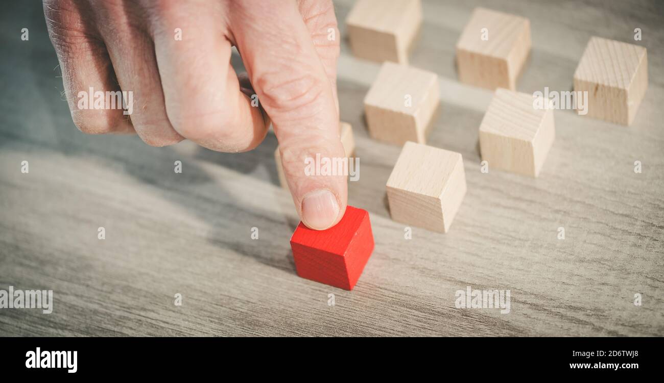 Concept of leadership with wooden cubes Stock Photo - Alamy
