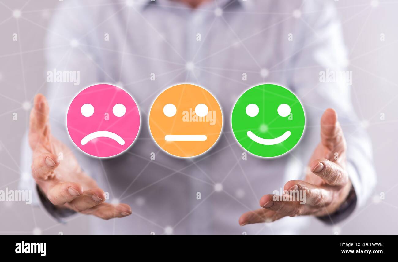 Customer satisfaction concept above the hands of a man in background ...