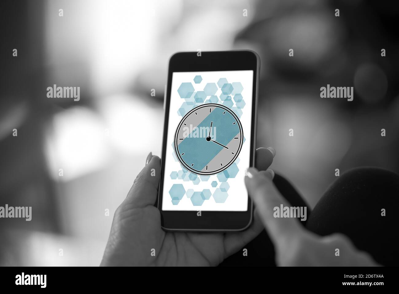 Hand holding a smartphone with time management concept Stock Photo - Alamy