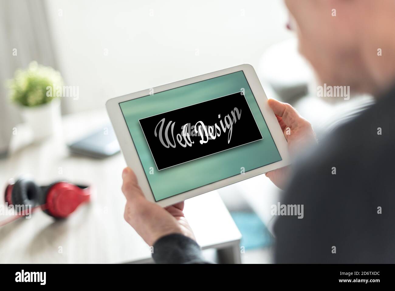 Tablet screen displaying a web design concept Stock Photo - Alamy