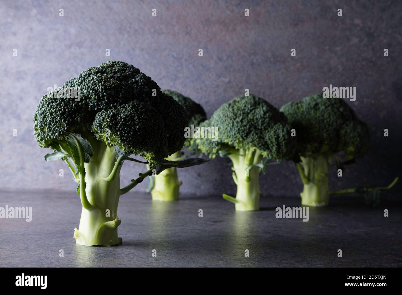 Four single stems of broccoli Stock Photo - Alamy