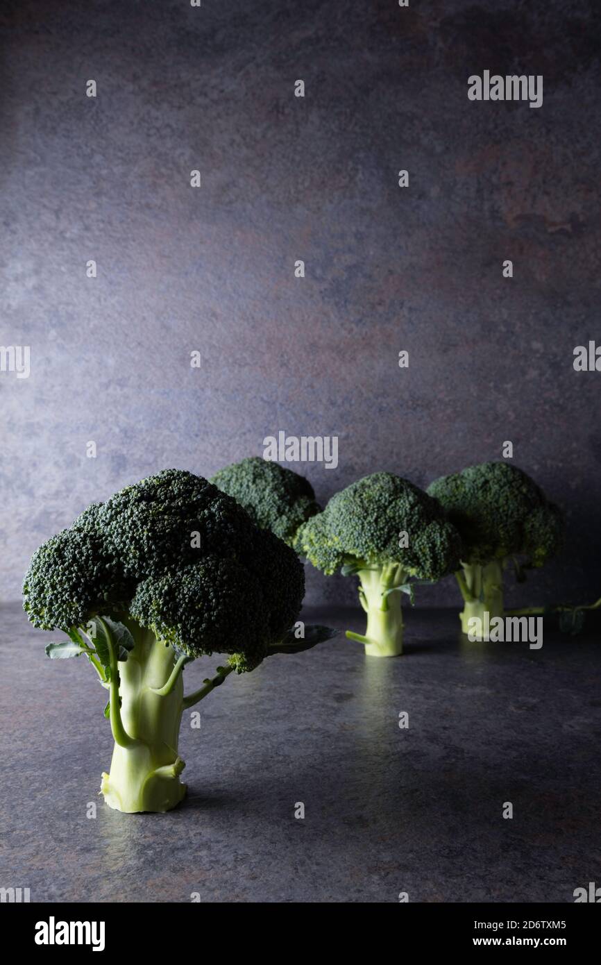 Four single stems of broccoli Stock Photo - Alamy