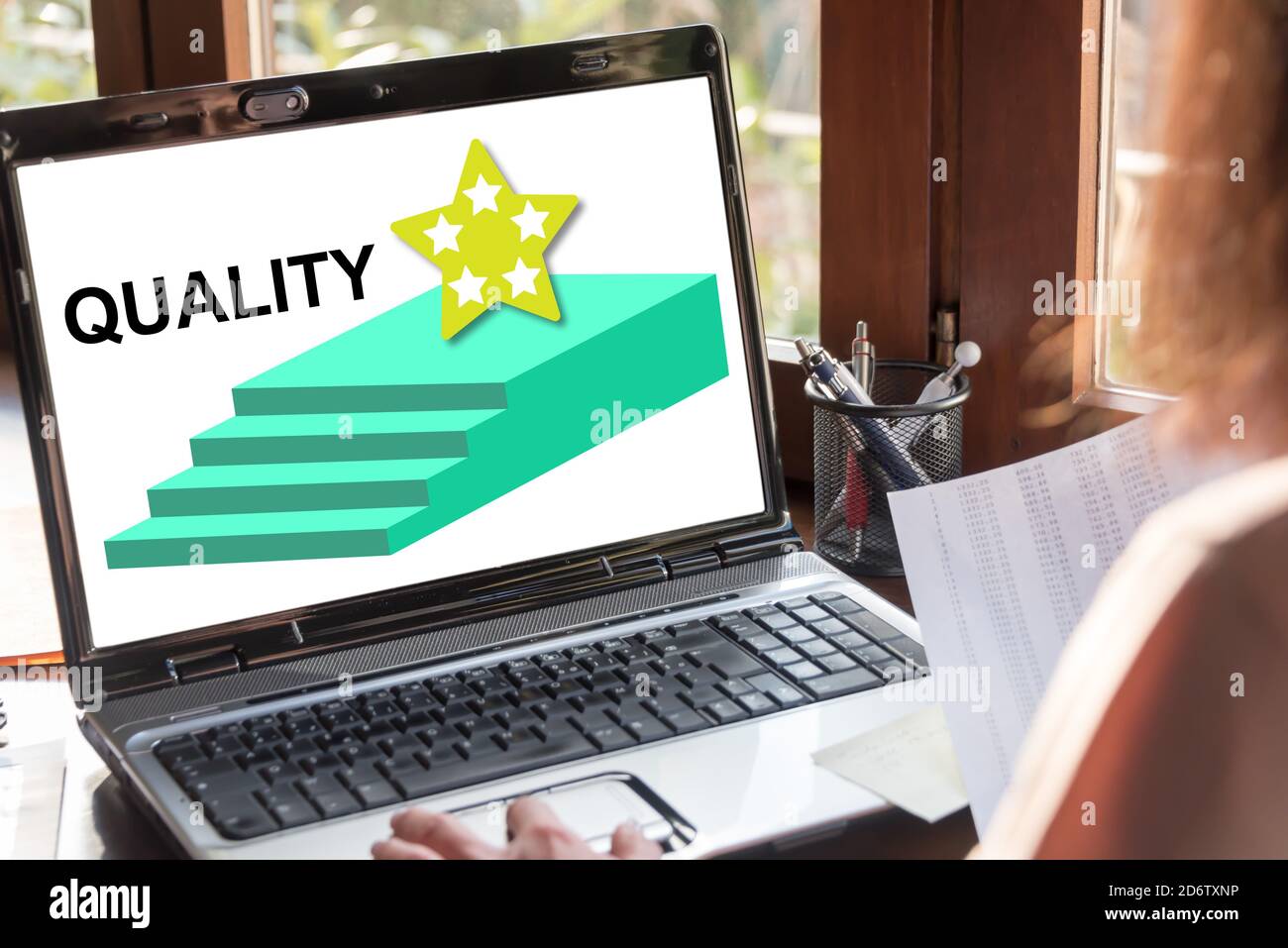 Laptop screen showing quality concept Stock Photo - Alamy