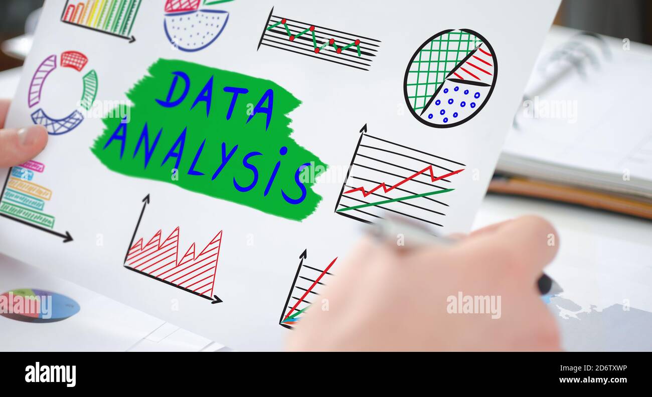 Hands holding a paper showing a data analysis concept Stock Photo - Alamy