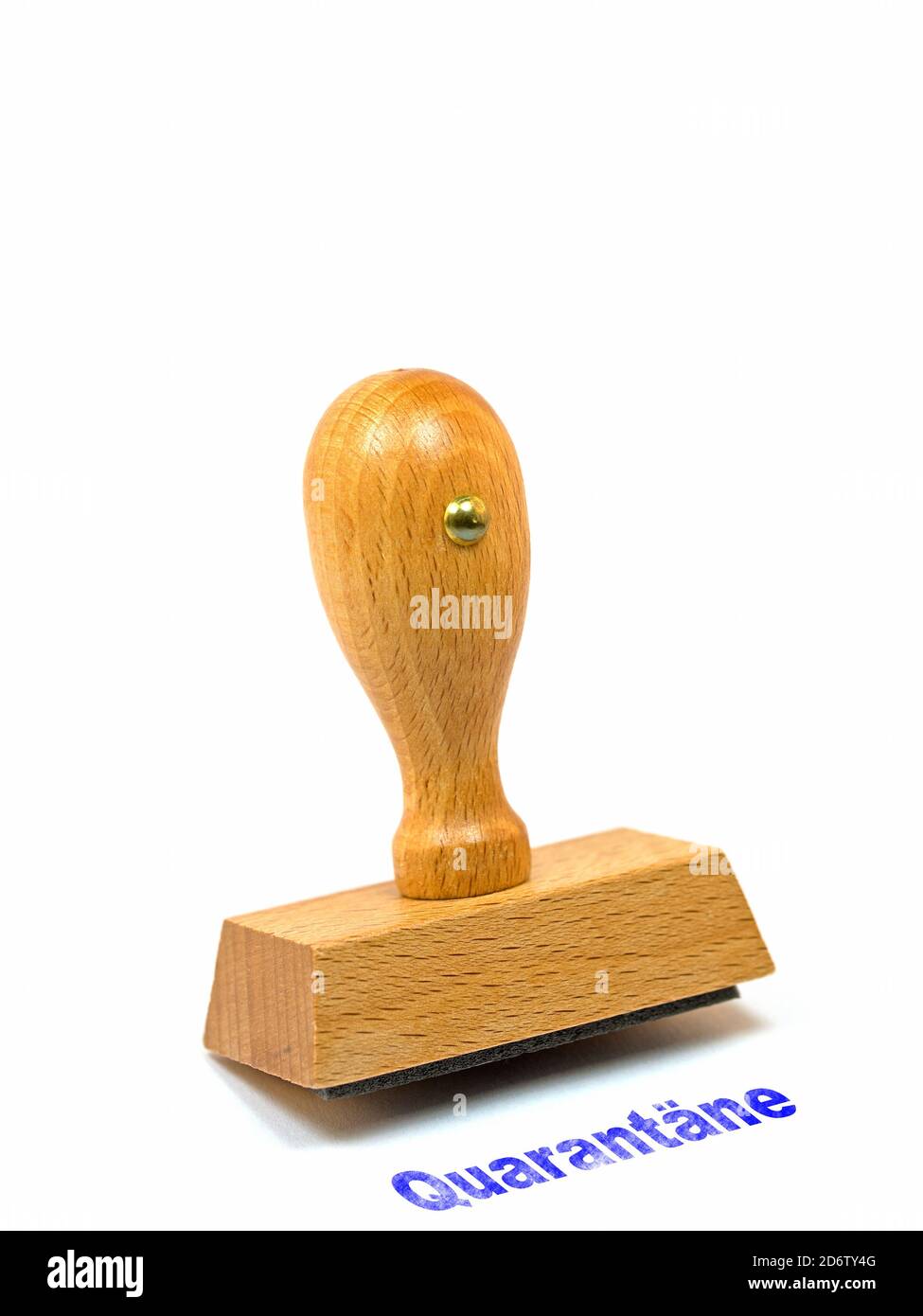 Rubber stamp saying "Quarantäne", translated "quarantine" against white ...