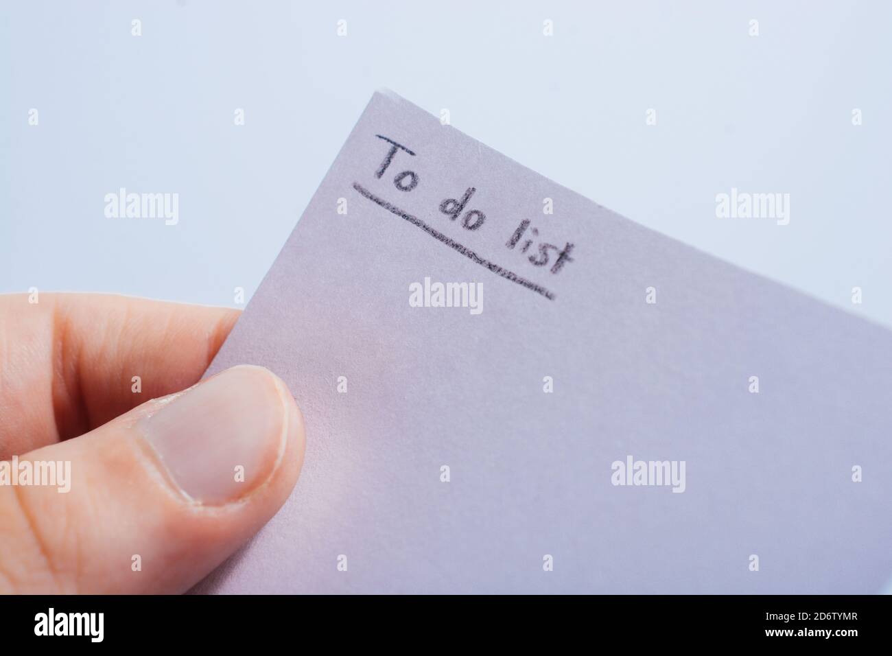 hands making a to-do list in a piece of paper Stock Photo - Alamy