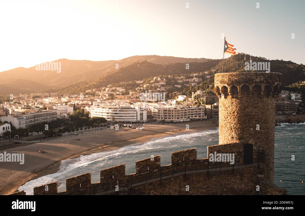 High angle shot of the Tossa de Mar castle by the sea captured in Spain ...