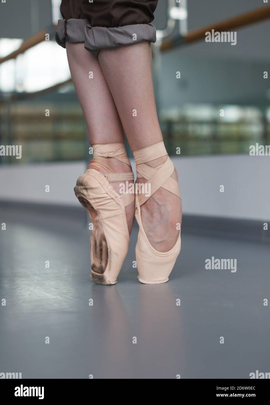 female ballerina feet in pointe shoes on point position, close up ...