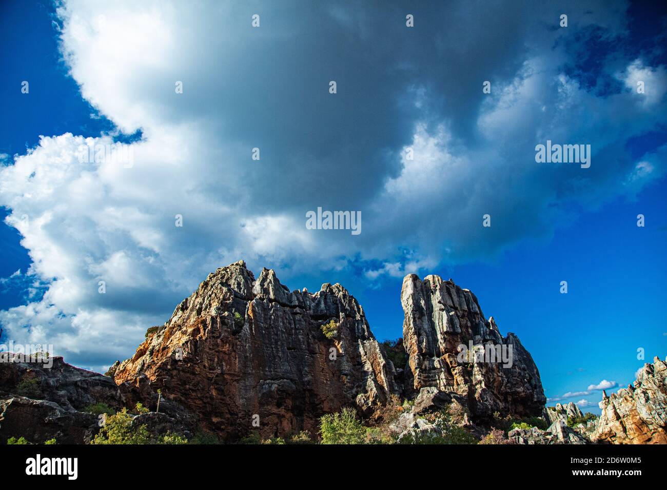 Spiky stone rocks with traces of ferrous earth Stock Photo - Alamy