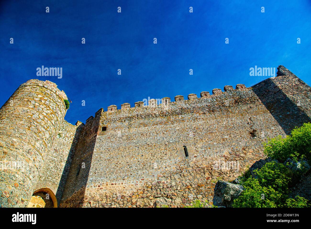 Great castle entrance wall built on rock base Stock Photo - Alamy