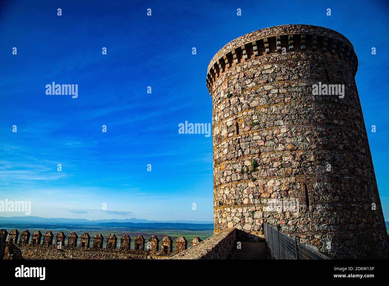 Round castle tower with deep blue background background Stock Photo - Alamy