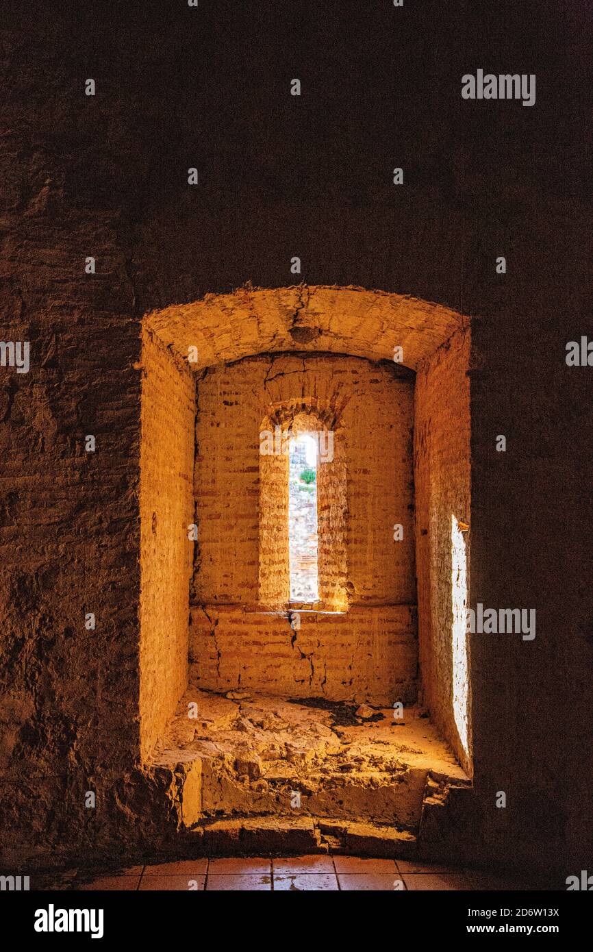 Light entering through medieval brick window in tower interior Stock ...