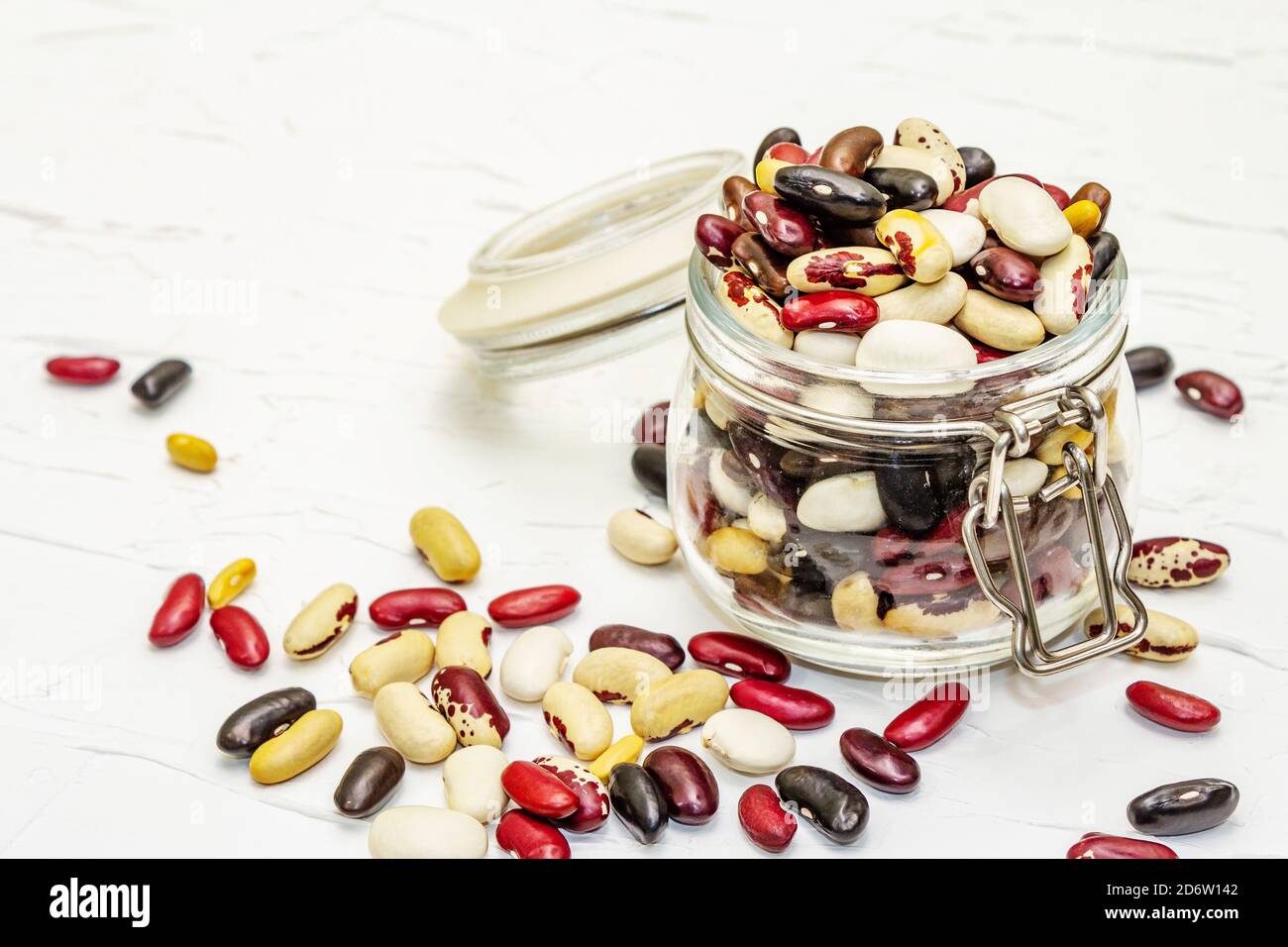 Assorted different types of beans in glass jar. Mix of various dry ...