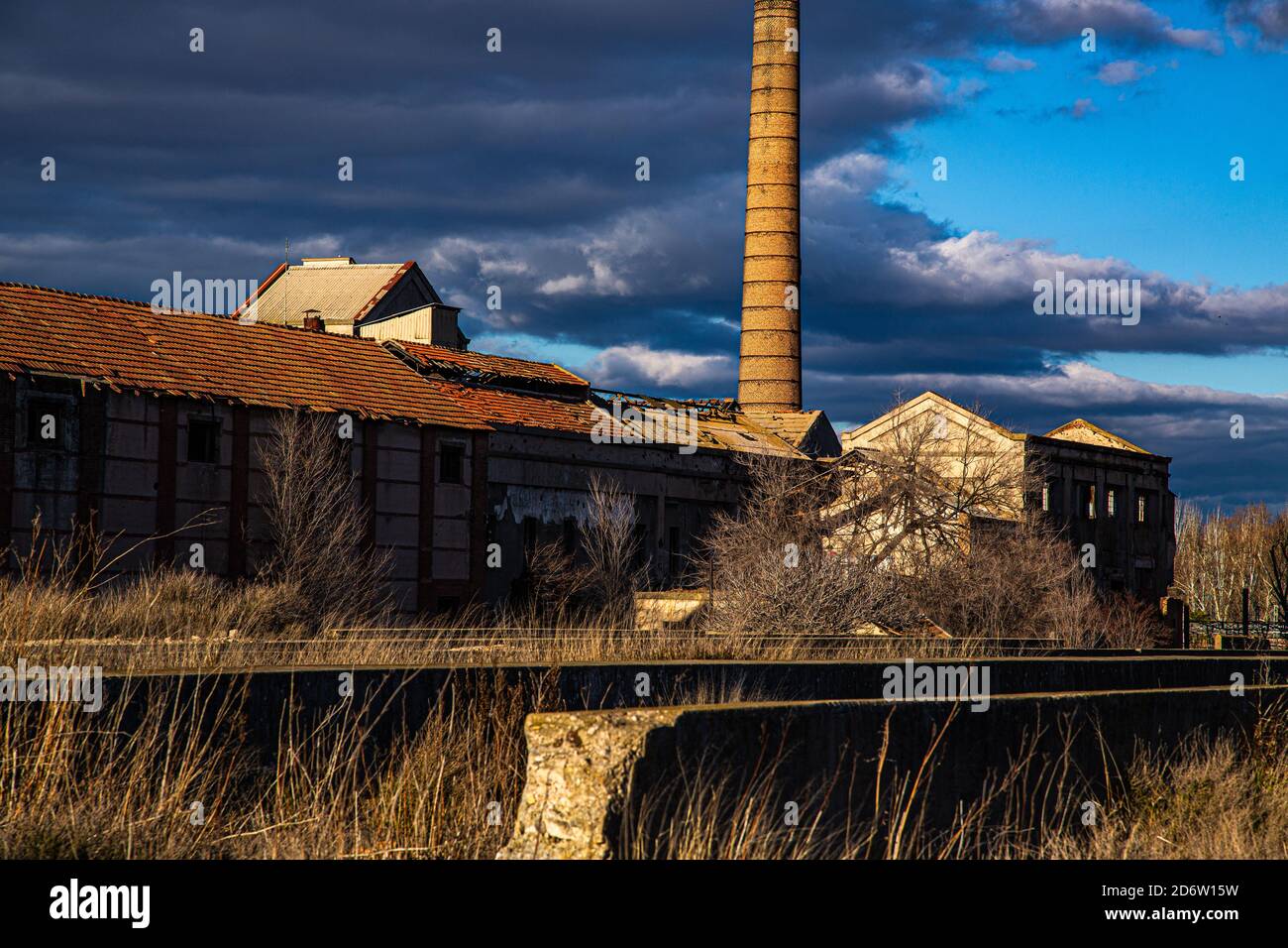 View of old factory with large sectional chimney Stock Photo - Alamy