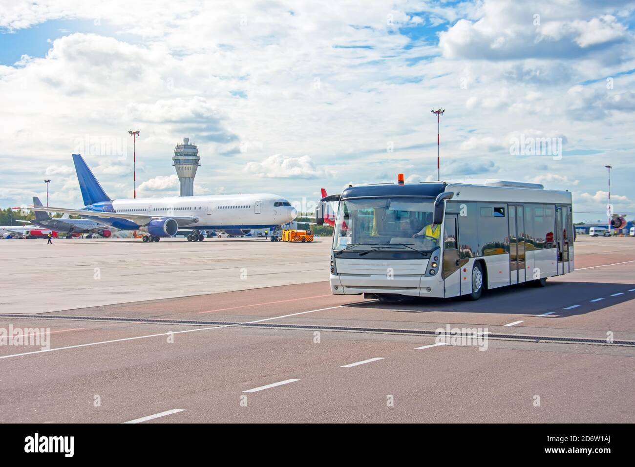 Bus for transporting passengers to boarding aircraft, against the ...
