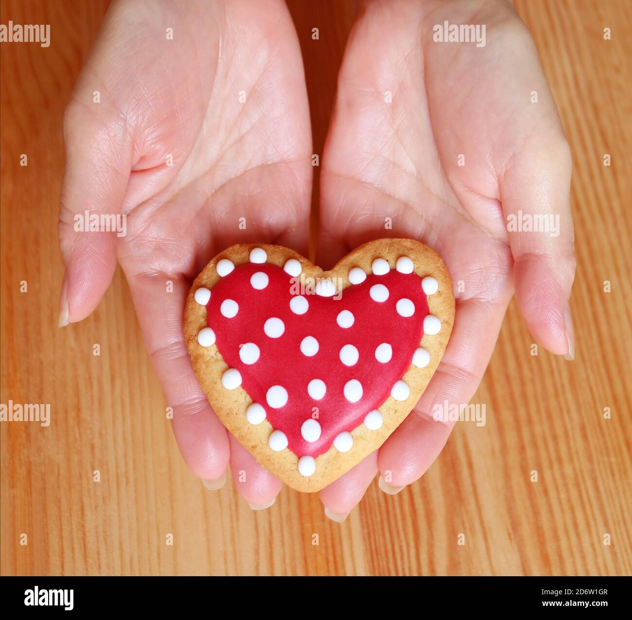 Hand offering heart symbol hi-res stock photography and images - Alamy