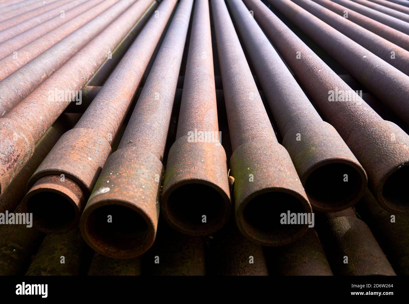 Stack of rusty tubes and drill rods for drilling Stock Photo - Alamy