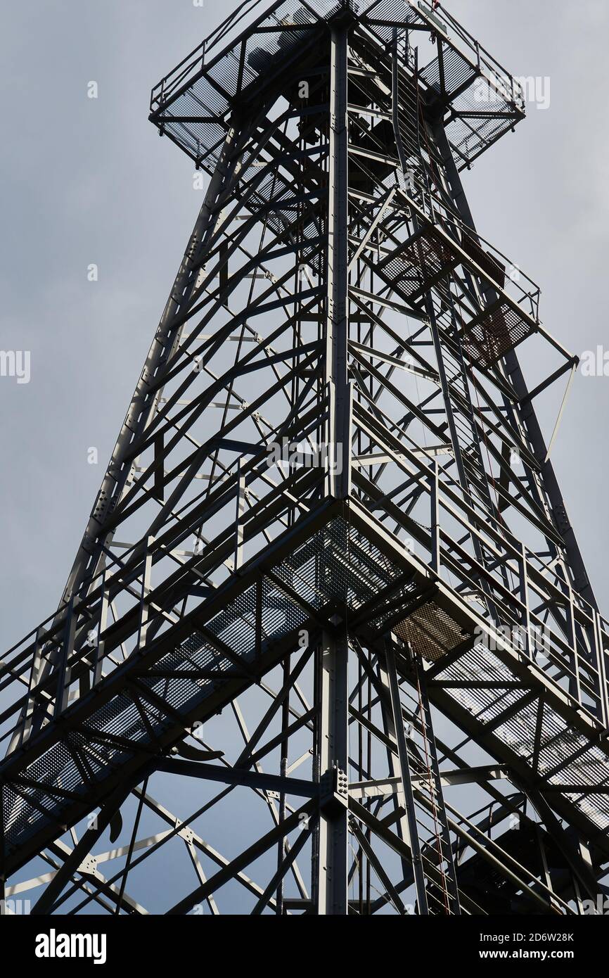 New drilling tower made of galvanized steel gratings against the sky ...