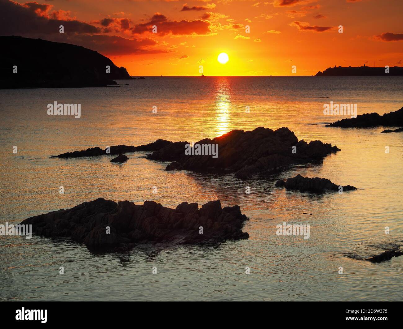 Stunning orange sunset over West Angle Bay and fishing boat ...