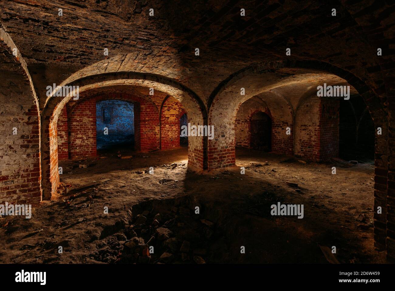 Dark and creepy vaulted red brick dungeon Stock Photo - Alamy