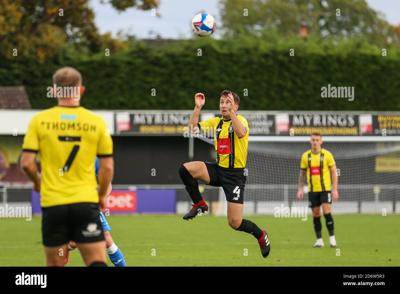 Josh Falkingham (4) of Harrogate Town jumps for the high ball Stock ...